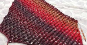 Knit an easy lace mega-scarf with gradient and glittery yarn